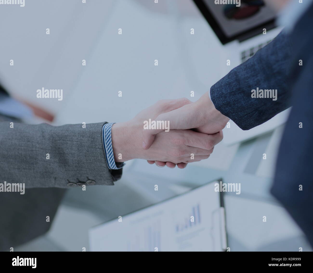 handshake of business partners after discussion of the financial Stock ...