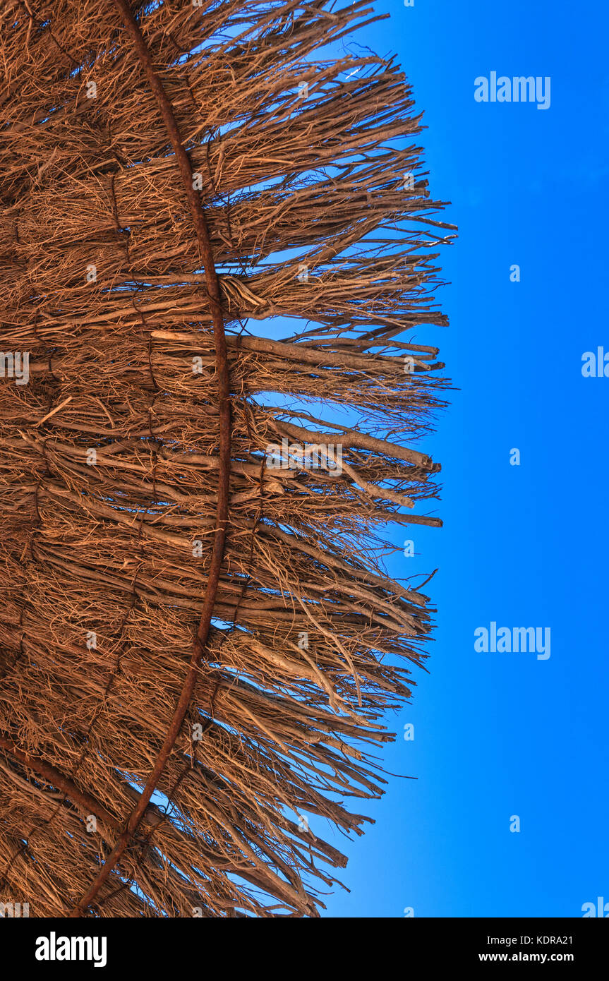 Straw Beach Parasol, Umbrella, Hot in the Shade Stock Photo - Alamy