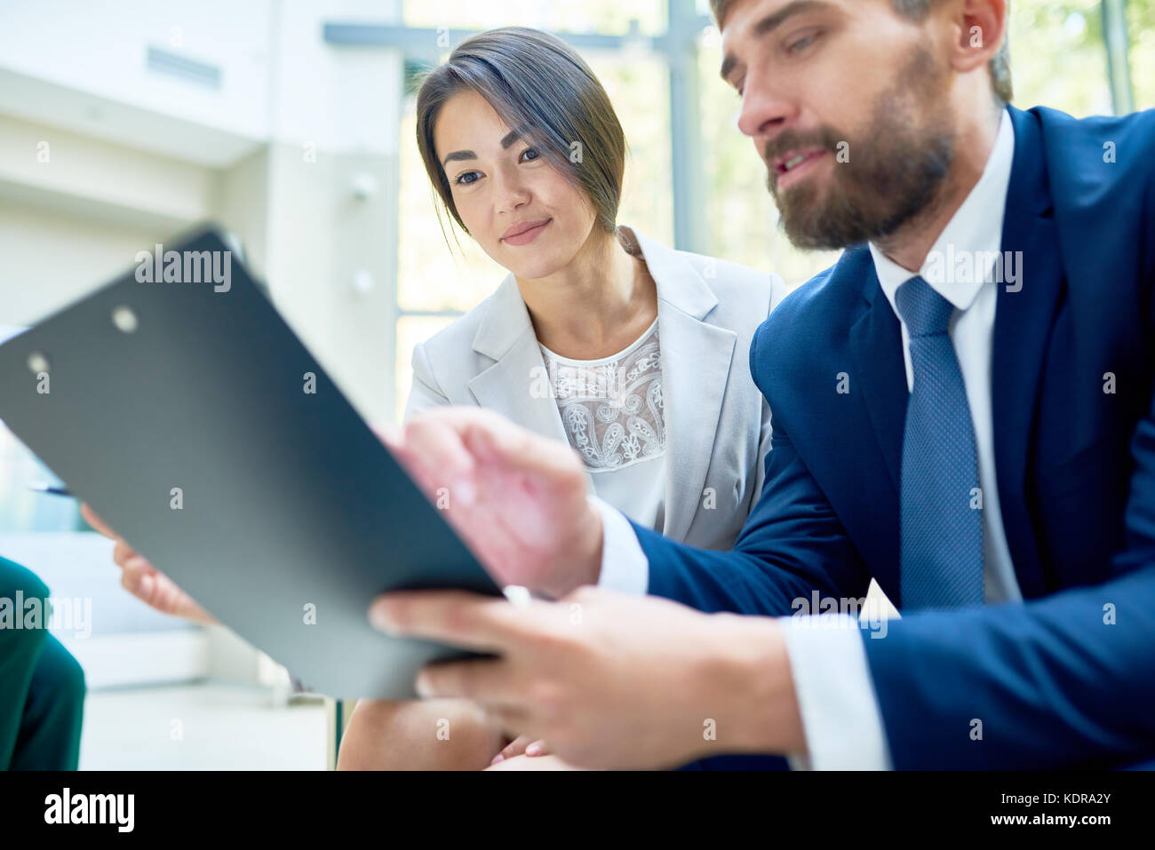 Sharing Business Ideas with Coworker Stock Photo - Alamy