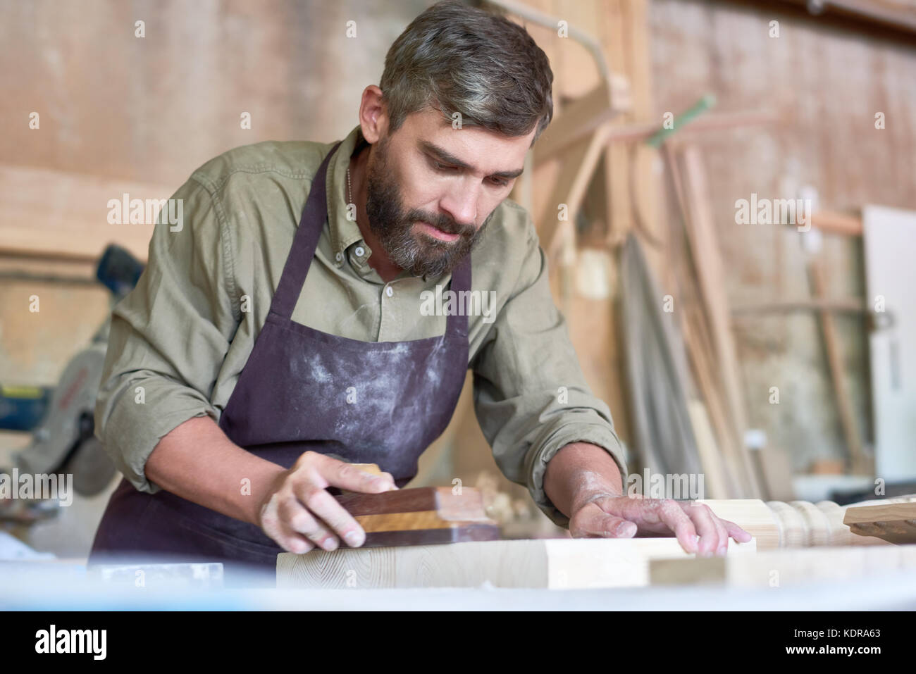 Bearded Carpenter Sanding Wood in Shop Stock Photo - Alamy
