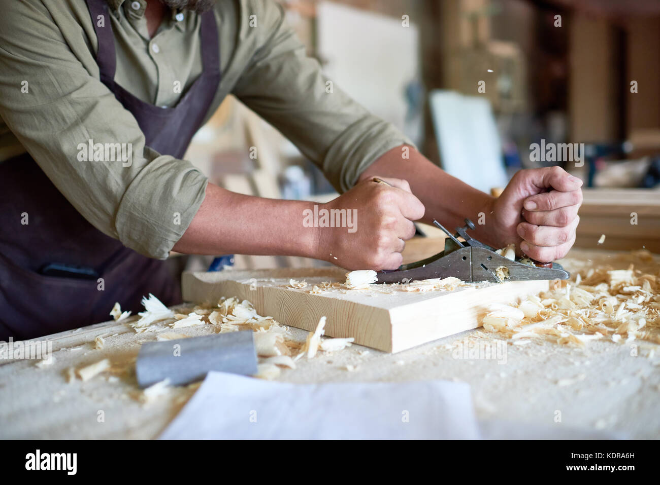 Carpenter Brushing Wood Stock Photo - Alamy