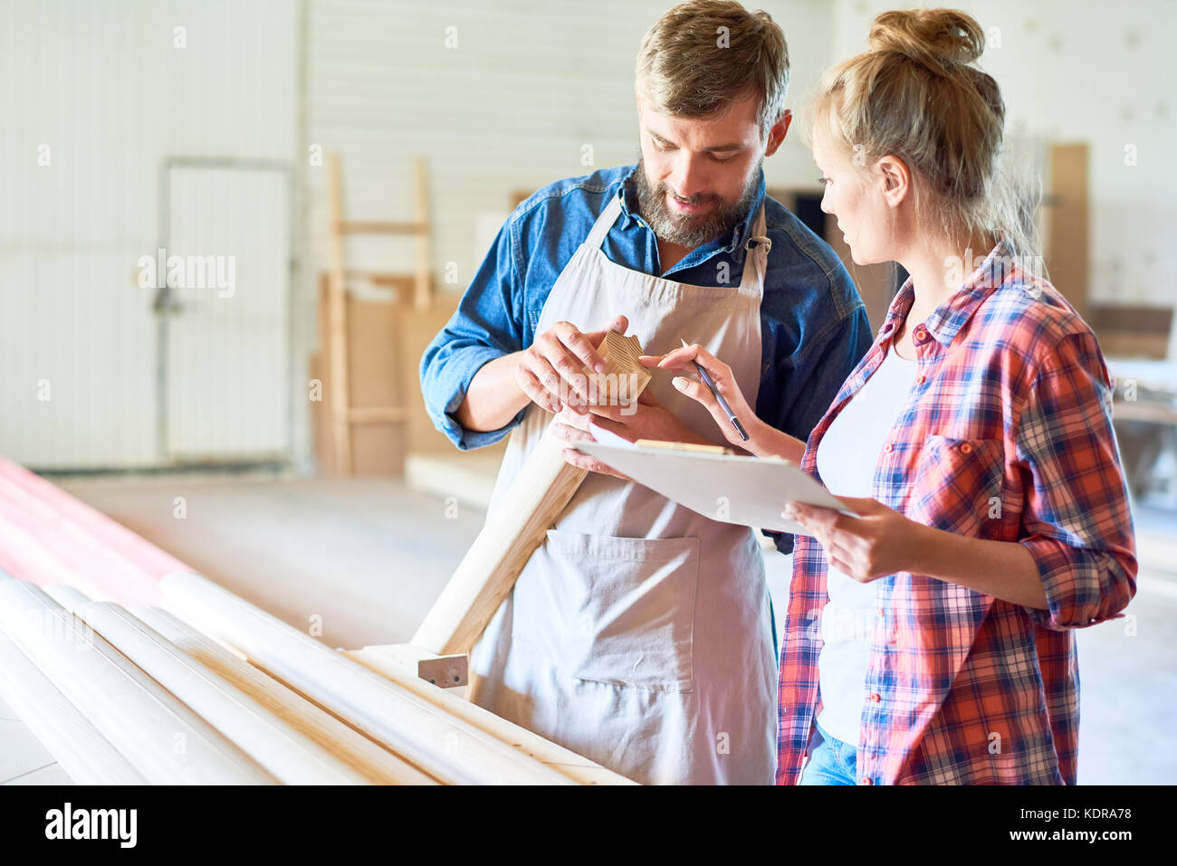 Modern Carpenters Choosing Wood in Joinery Stock Photo - Alamy