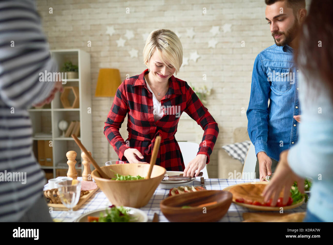 Young People Making Dinner Together Stock Photo - Alamy