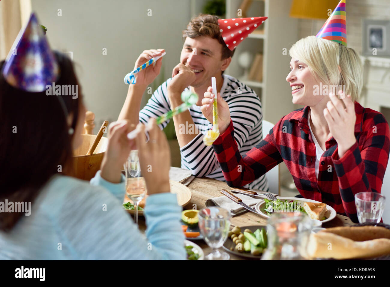 Happy Couples Celebrating Birthday at Dinner Table Stock Photo - Alamy