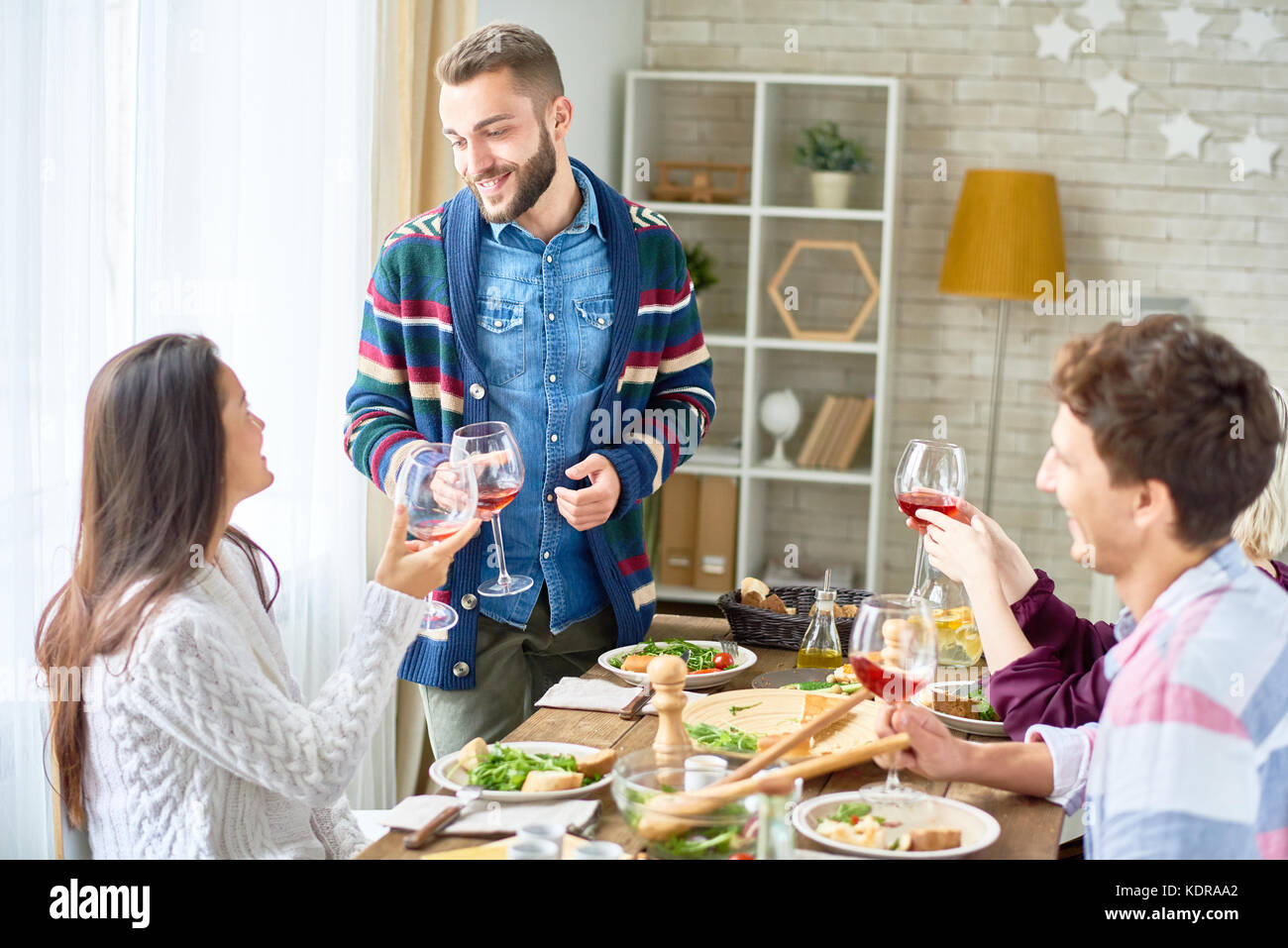 Friends Toasting at Dinner Stock Photo - Alamy