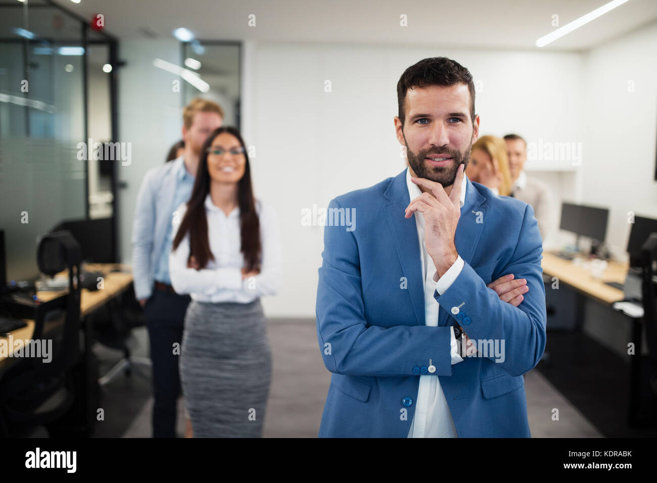 Smart successful colleagues standing hi-res stock photography and ...