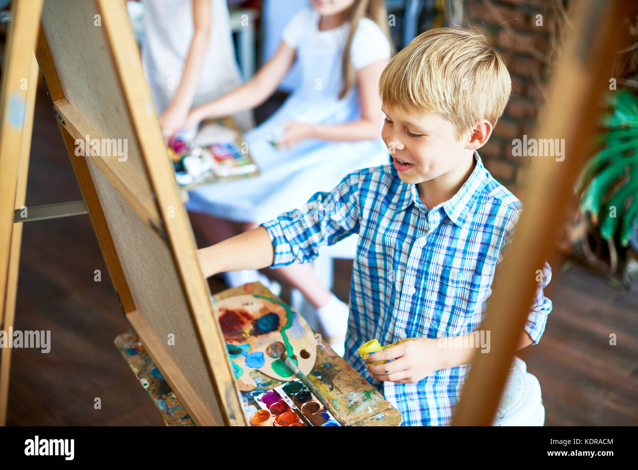 Little Boy Enjoying Art Class Stock Photo - Alamy