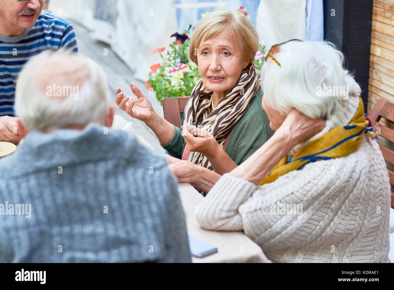 Senior Friends in Cafe Together Stock Photo - Alamy