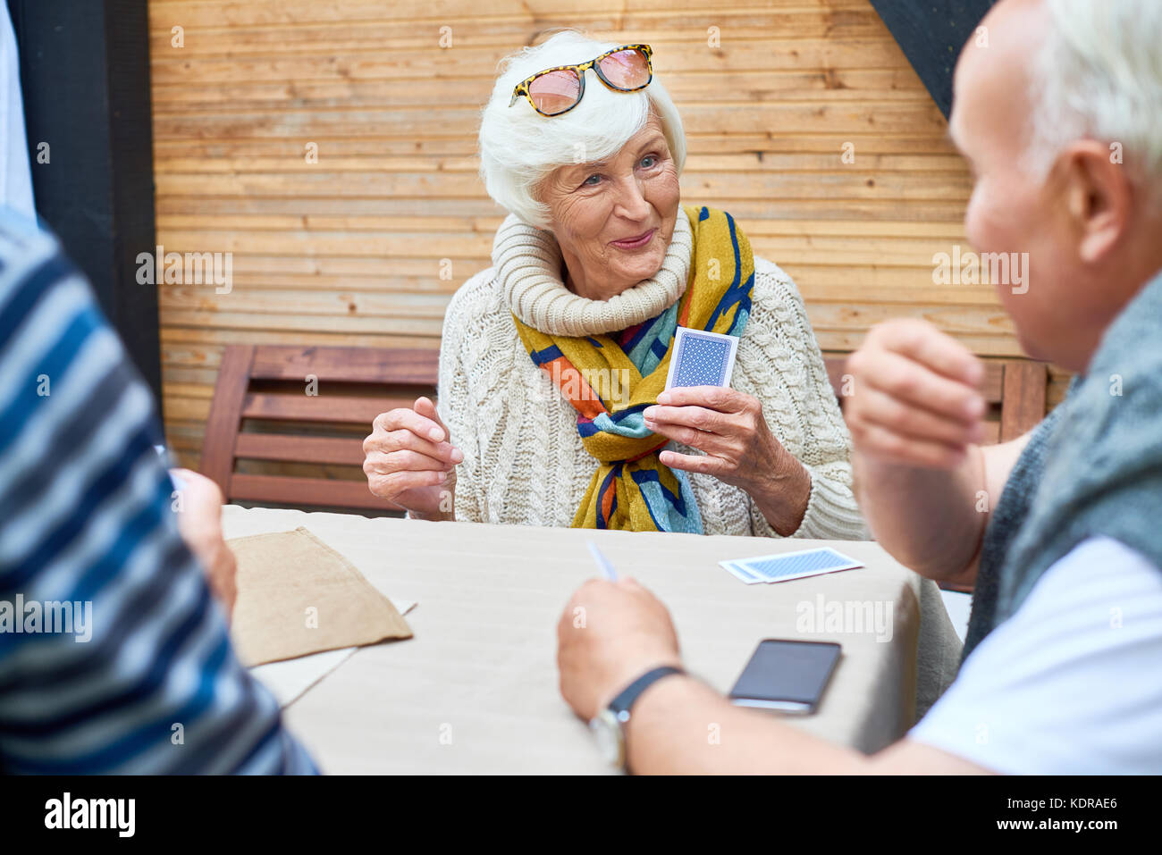 Senior Lady Playing Cards with Friends Stock Photo - Alamy
