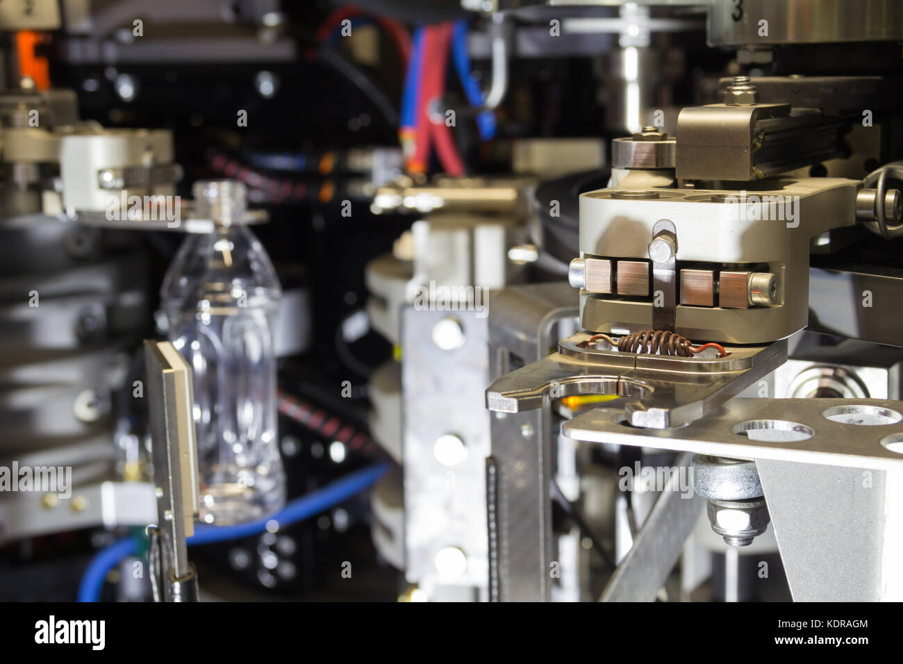 PET bottles blowing. The plastic bottle blowing machine.Heating process ...