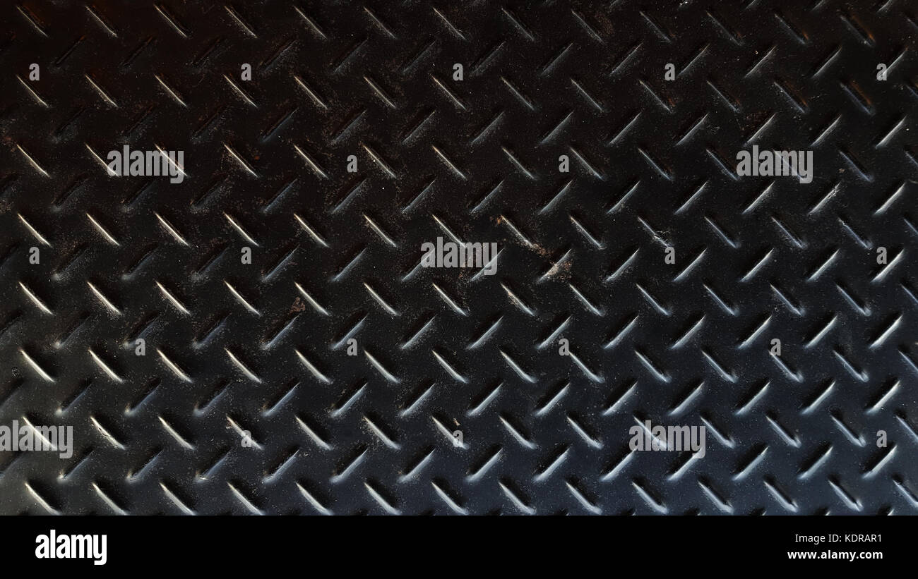 Rusty black diamond pattern iron metal plate Stock Photo - Alamy