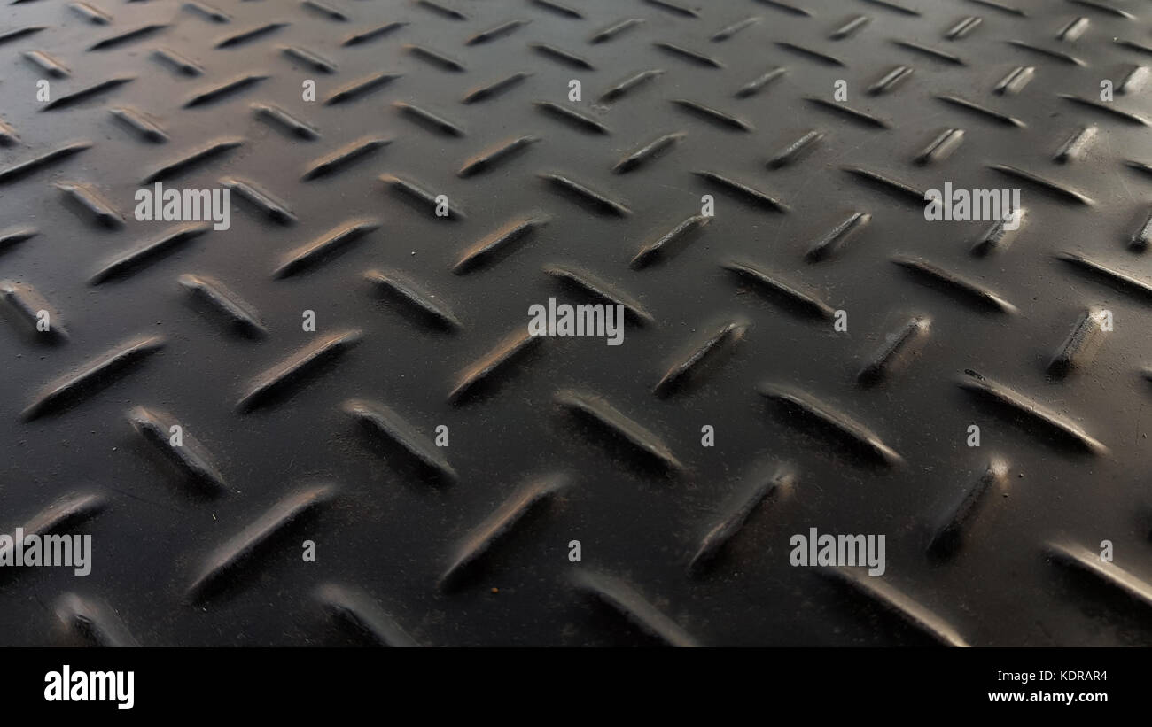 Rusty black diamond pattern iron metal plate Stock Photo - Alamy