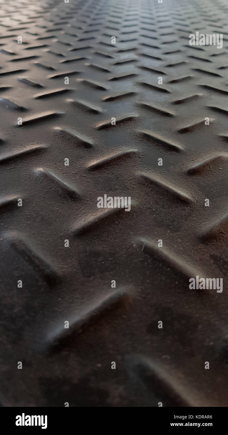 Rusty black diamond pattern iron metal plate Stock Photo - Alamy