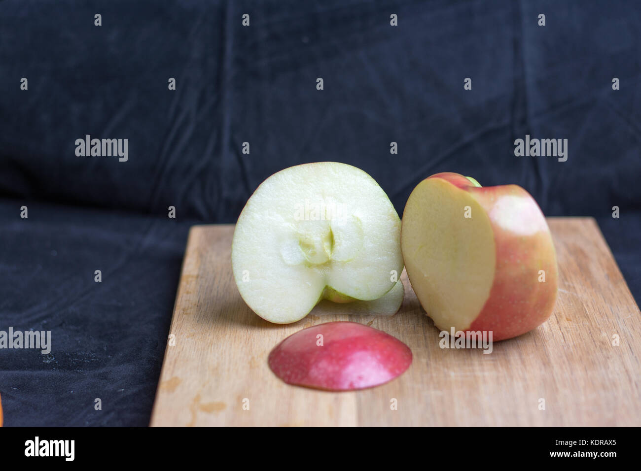 honey crisp apple cut on cutting board Stock Photo - Alamy