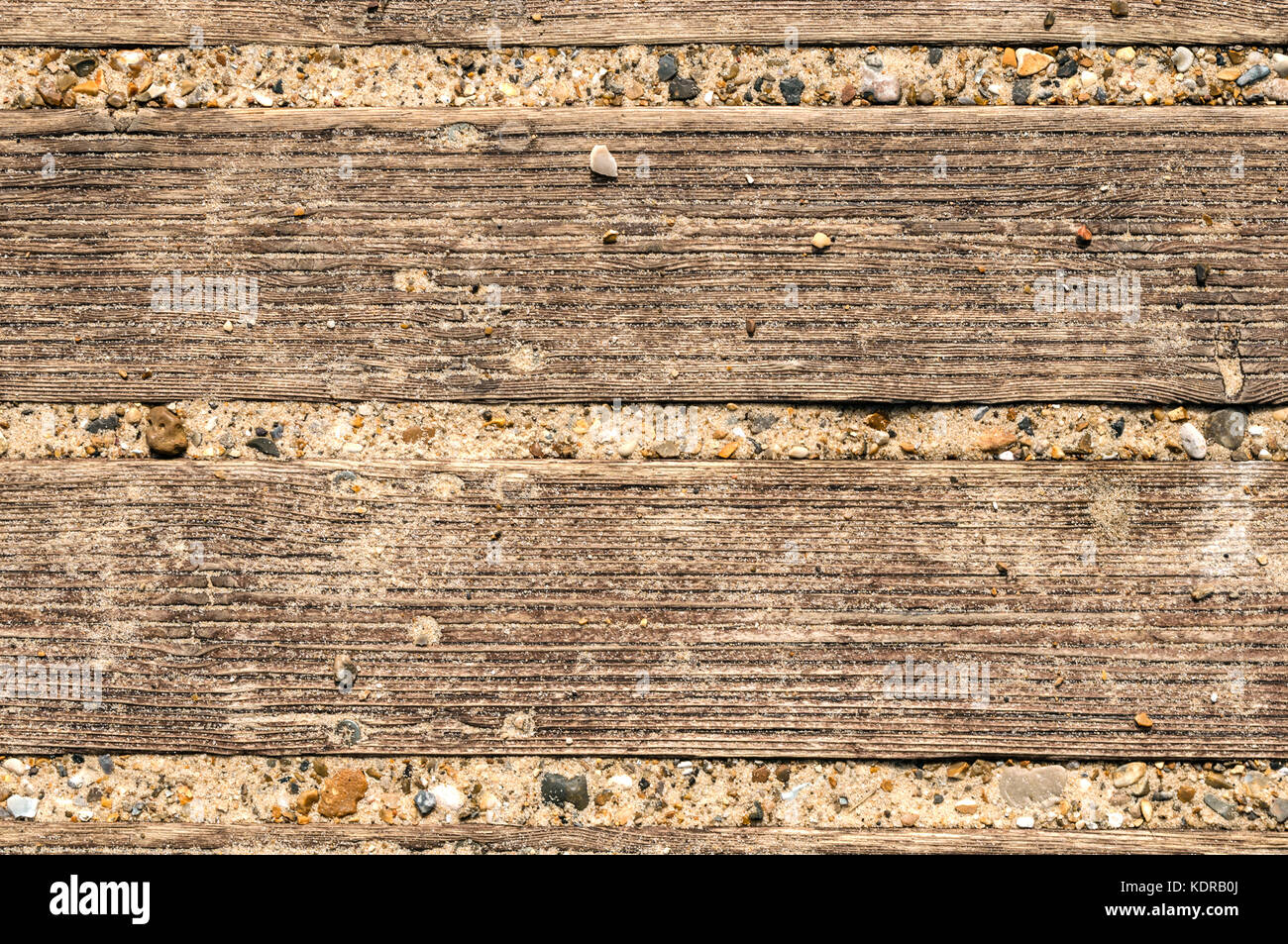 Sand on a Wooden Decking Background Stock Photo - Alamy