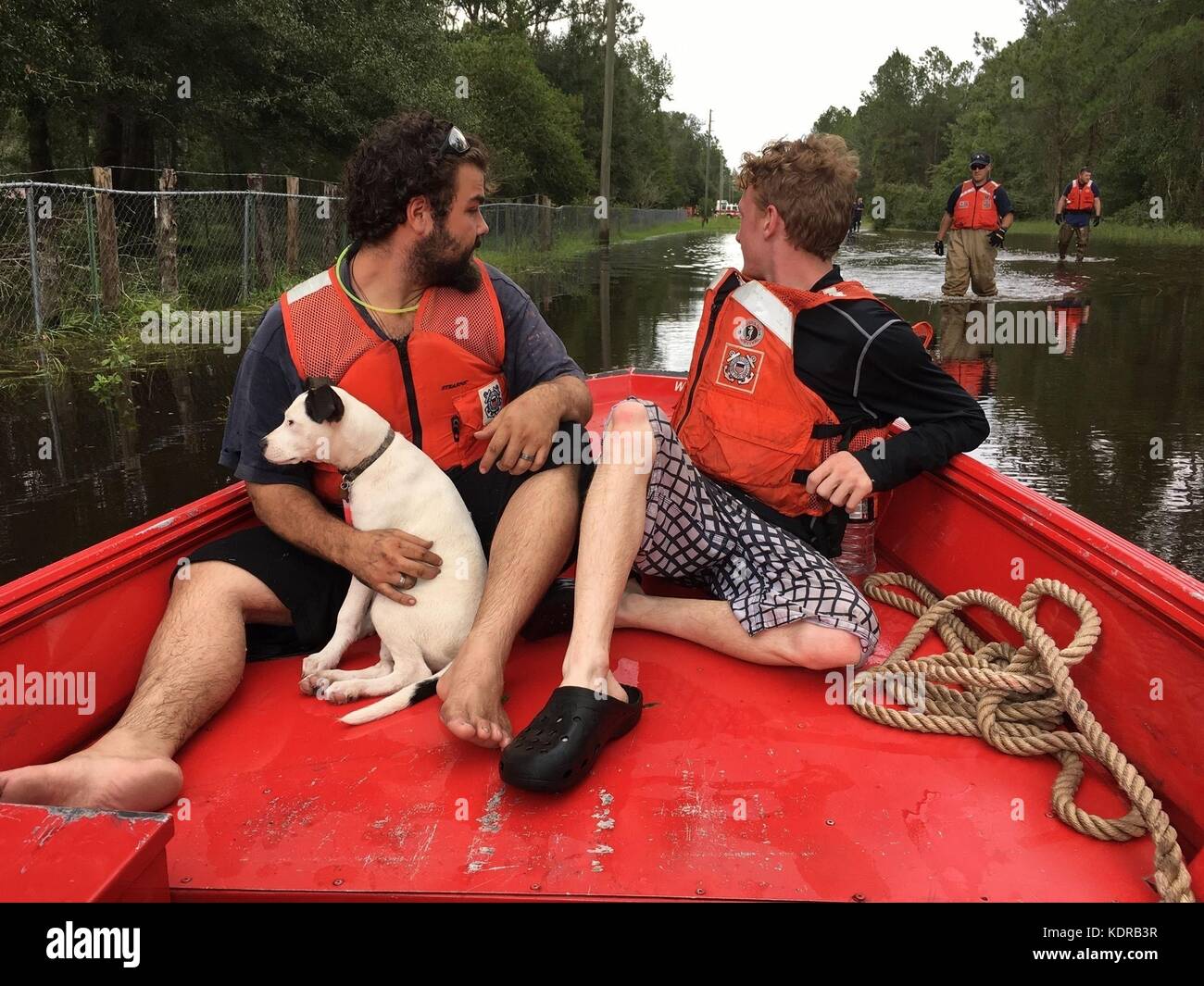 U.S. Coast Guard Flood Punt Teams rescue residents from a flooded ...