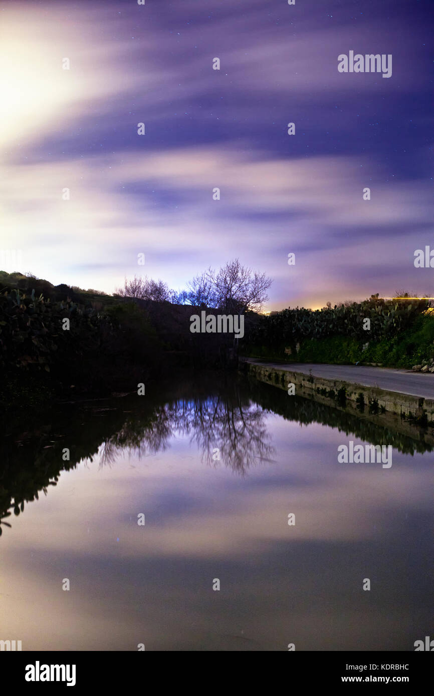 Chadwick Lakes in Malta, here seen at night. The long exposure gives an ...