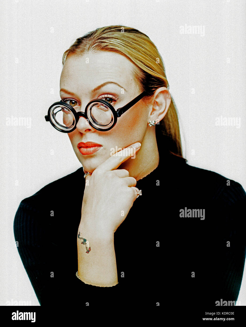 Young woman. Studio portrait. Thick lense spectacles Stock Photo - Alamy