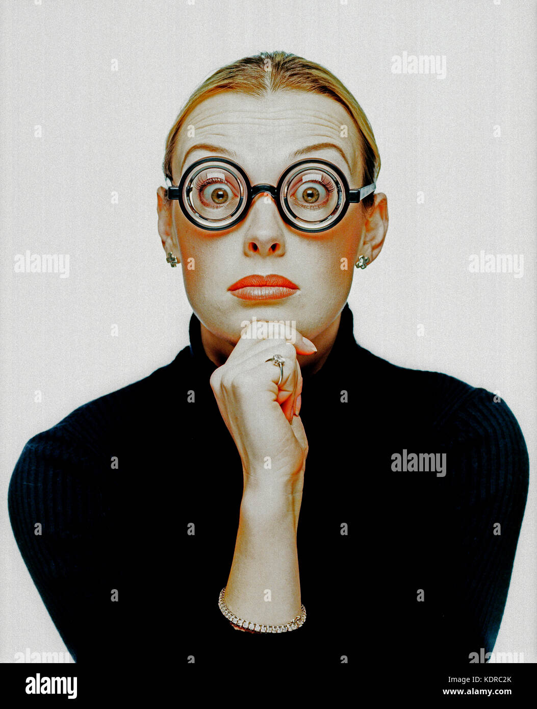 Young woman. Studio portrait. Thick lense spectacles Stock Photo - Alamy