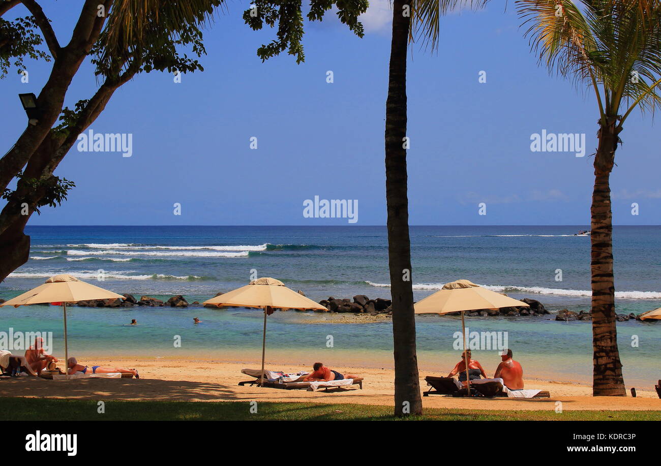 Balaclava, Mauritius - unidentified tourists relax on the beach at ...
