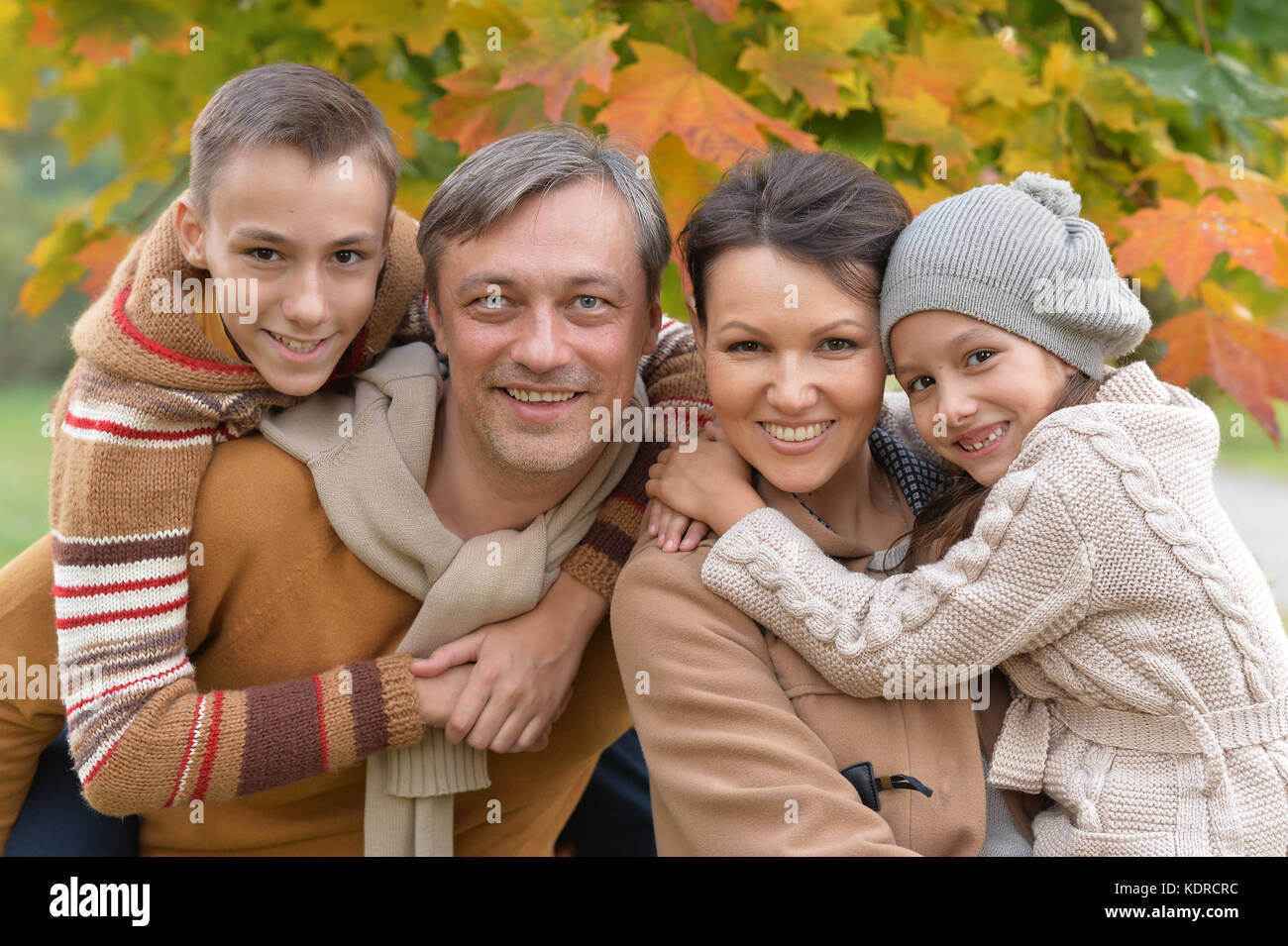Happy family in park Stock Photo - Alamy