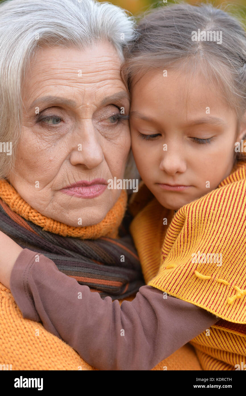 sad grandmother with granddaughter Stock Photo - Alamy