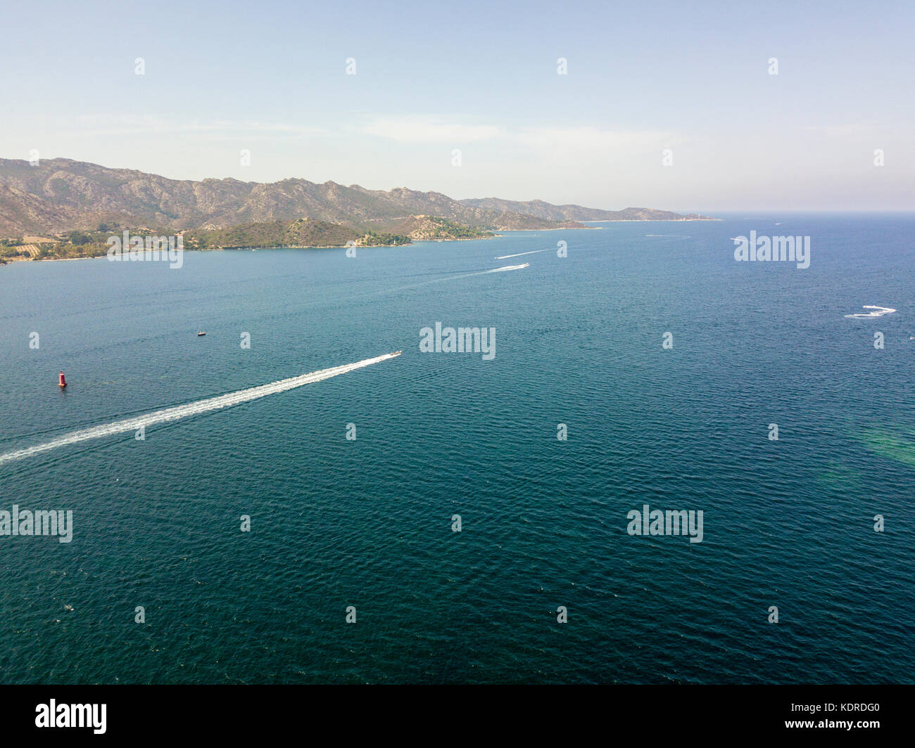 Boat sailing from above and coastline stretch of coast, beach and ...