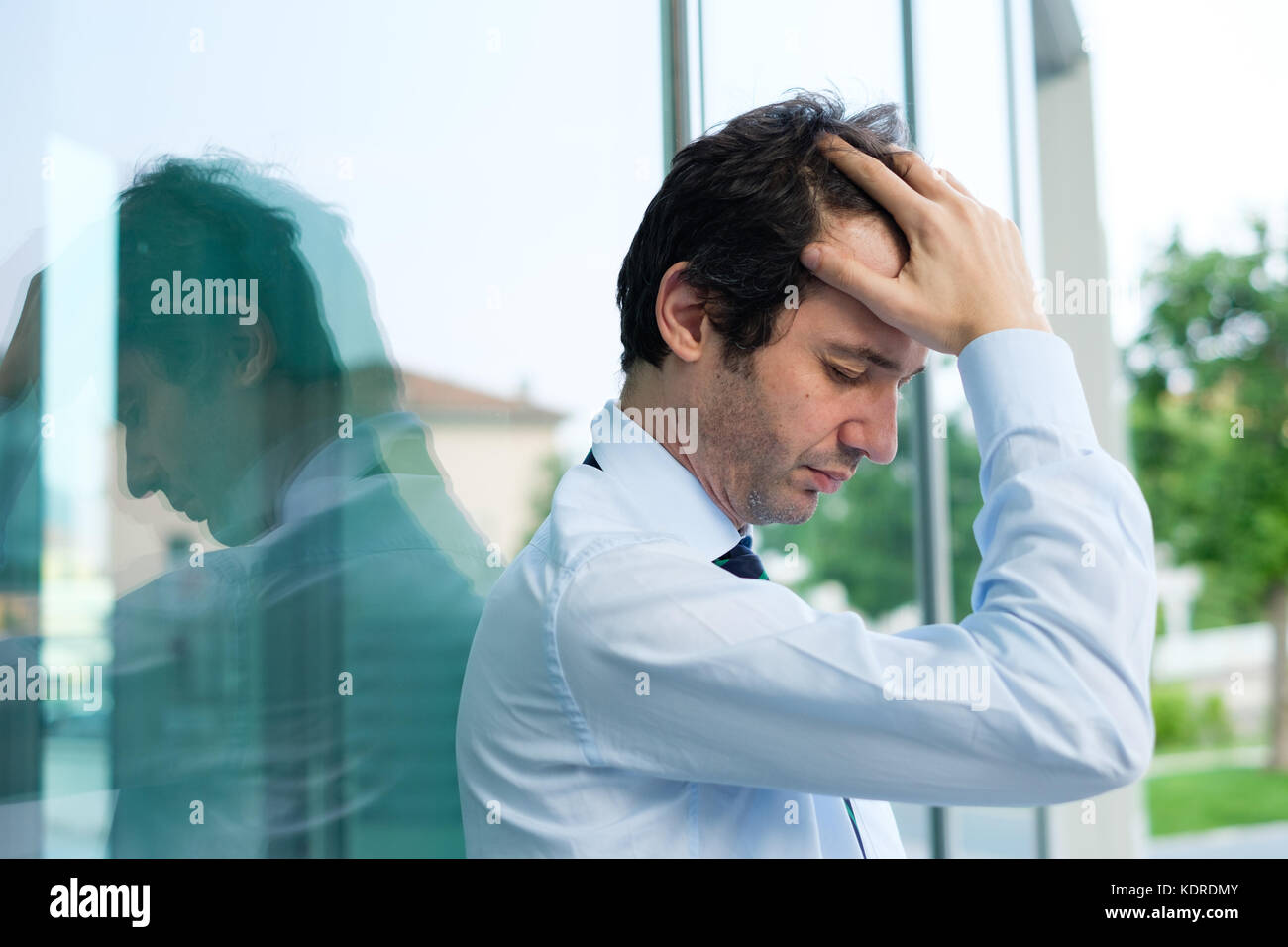 Desperate and stressed businessman feeling bad outside the office Stock ...
