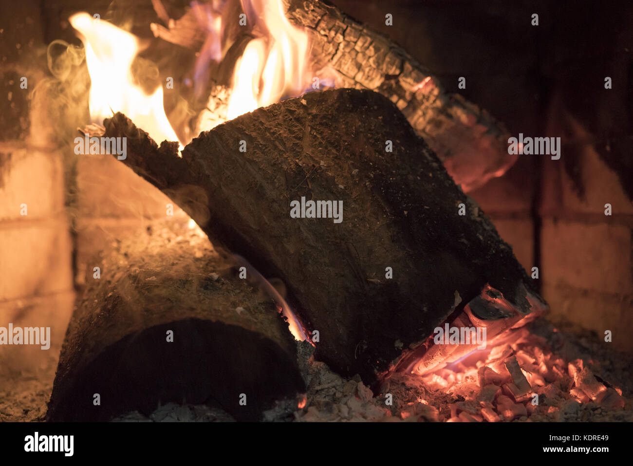 Three decks burn out in the fireplace Stock Photo - Alamy