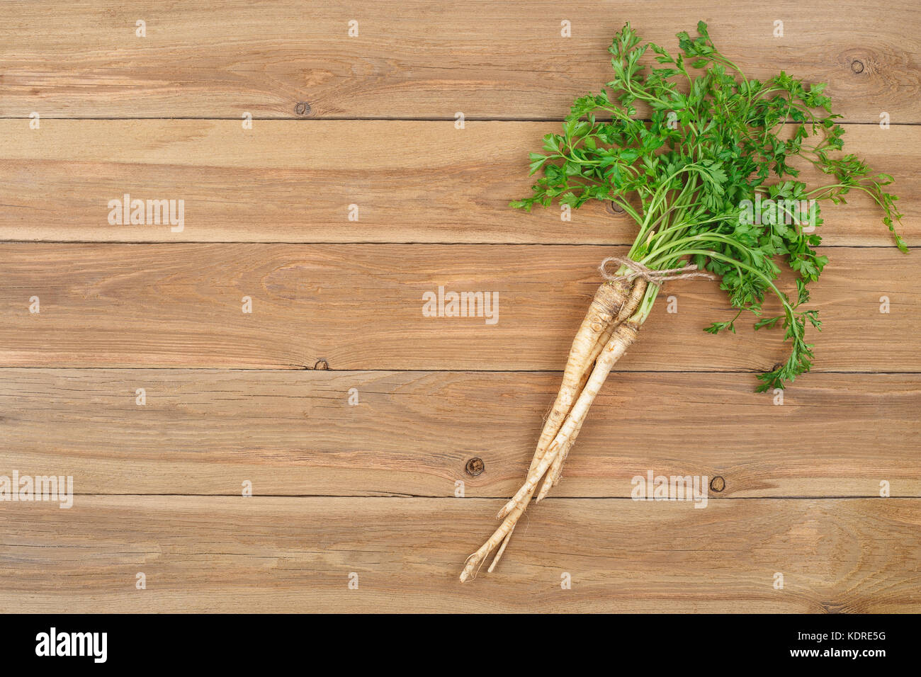 parsley roots on table top view Stock Photo - Alamy