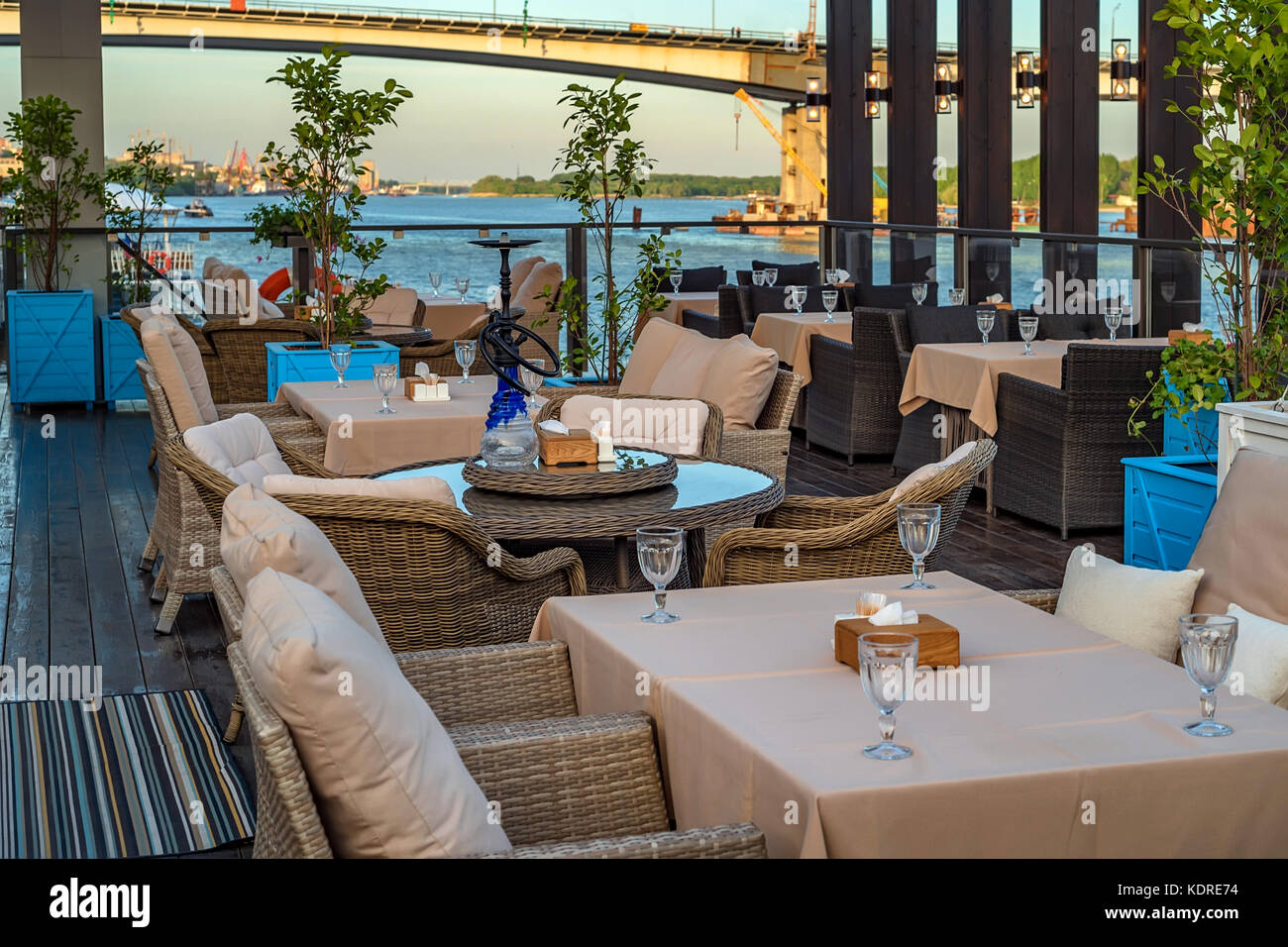Interior of restaurant on water, sofa and table Stock Photo - Alamy