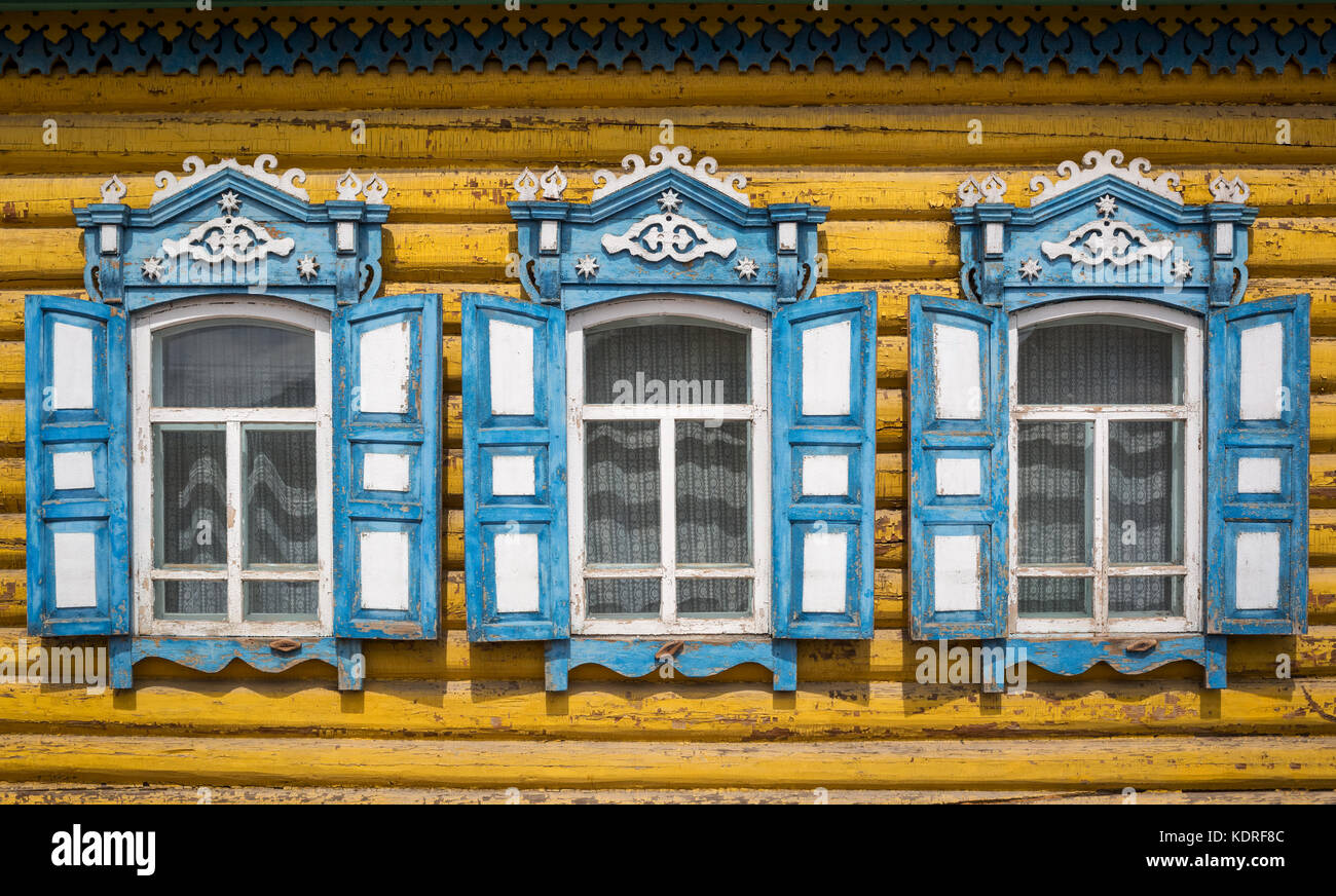 three windows with shutters Stock Photo - Alamy