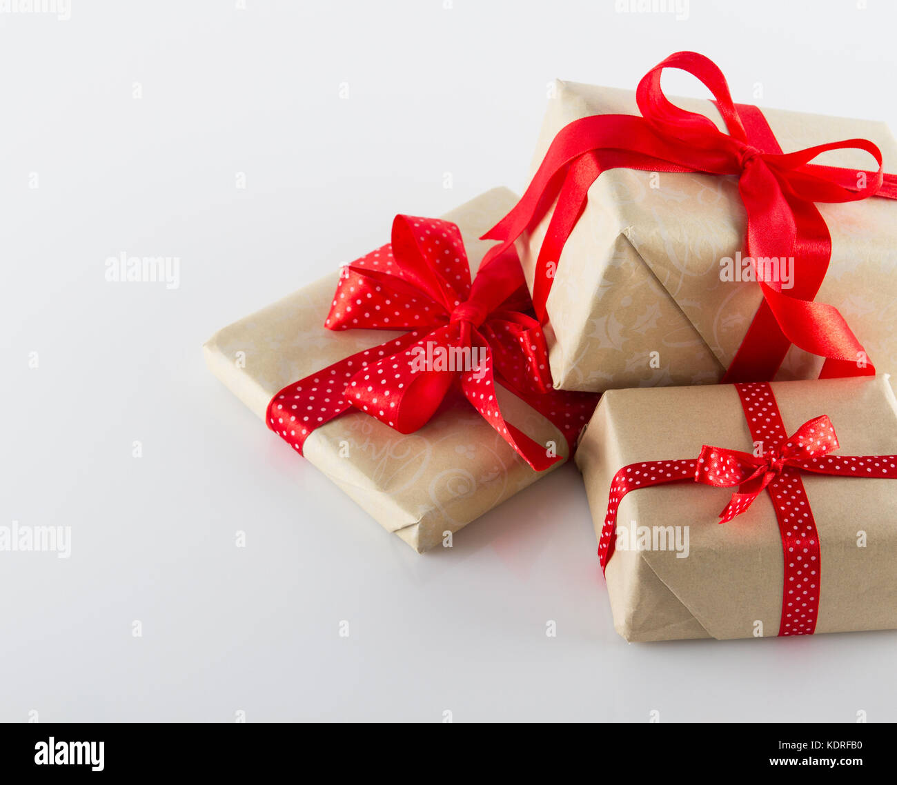 Three gifts boxes with ribbons on white Stock Photo - Alamy
