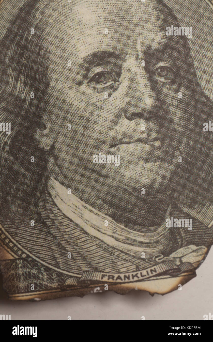 Burning portrait Benjamin Franklin on white background Stock Photo - Alamy