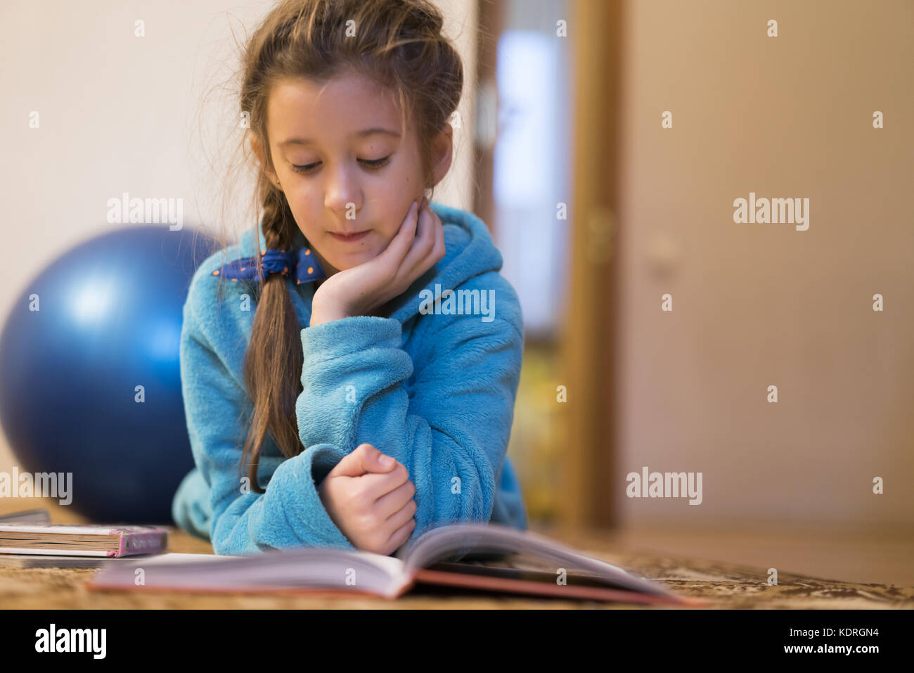 Child girl reading her favorite story Stock Photo - Alamy