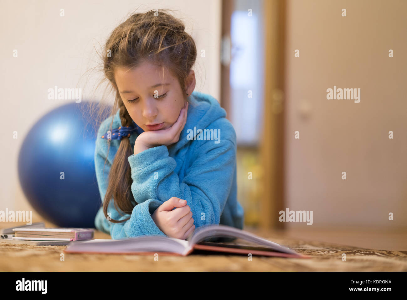 Child girl reading her favorite story Stock Photo - Alamy