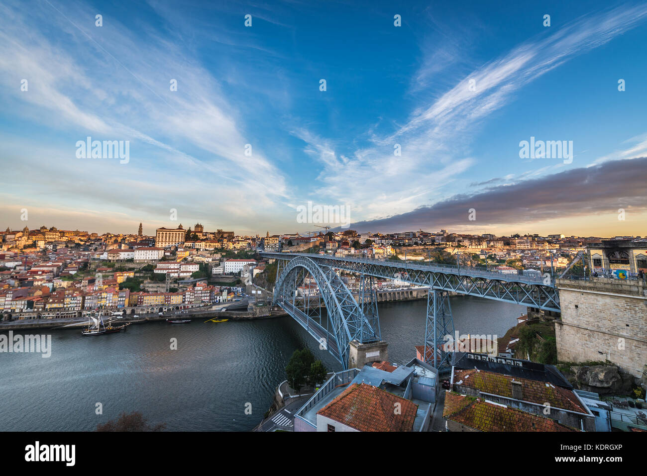 Famous Dom Luis I arch bridge over Douro River between cities of Porto ...