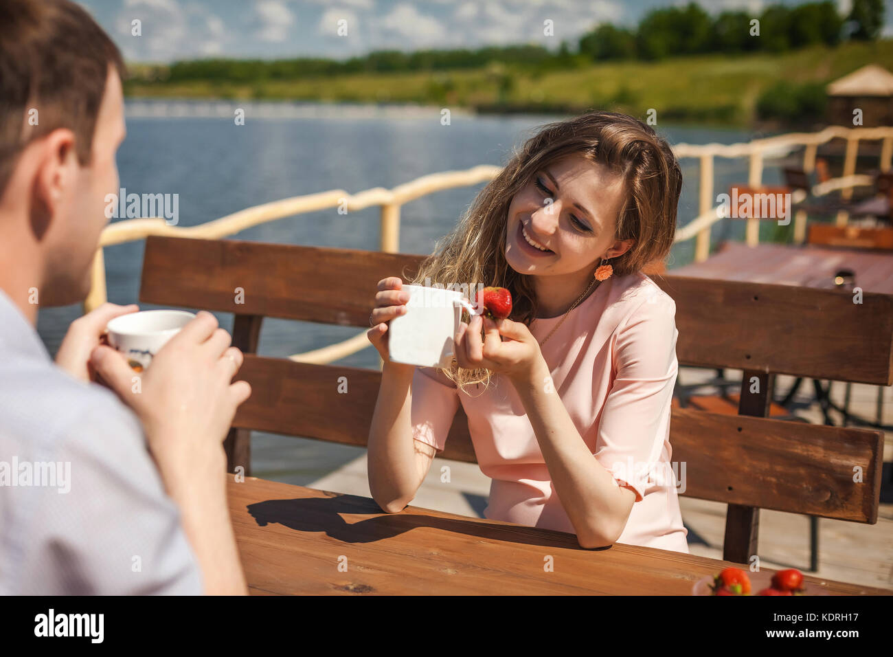 young couple drinking tea outdoors Stock Photo - Alamy