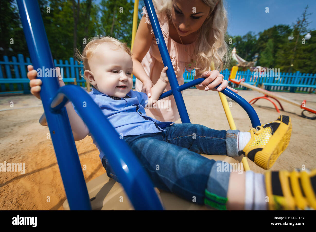 joyful boy on swing Stock Photo - Alamy