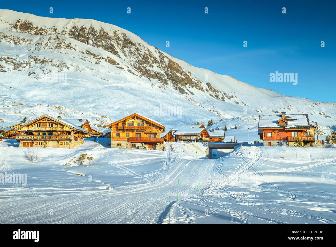 Wonderful winter landscape with wooden chalets and ski slopes in French ...