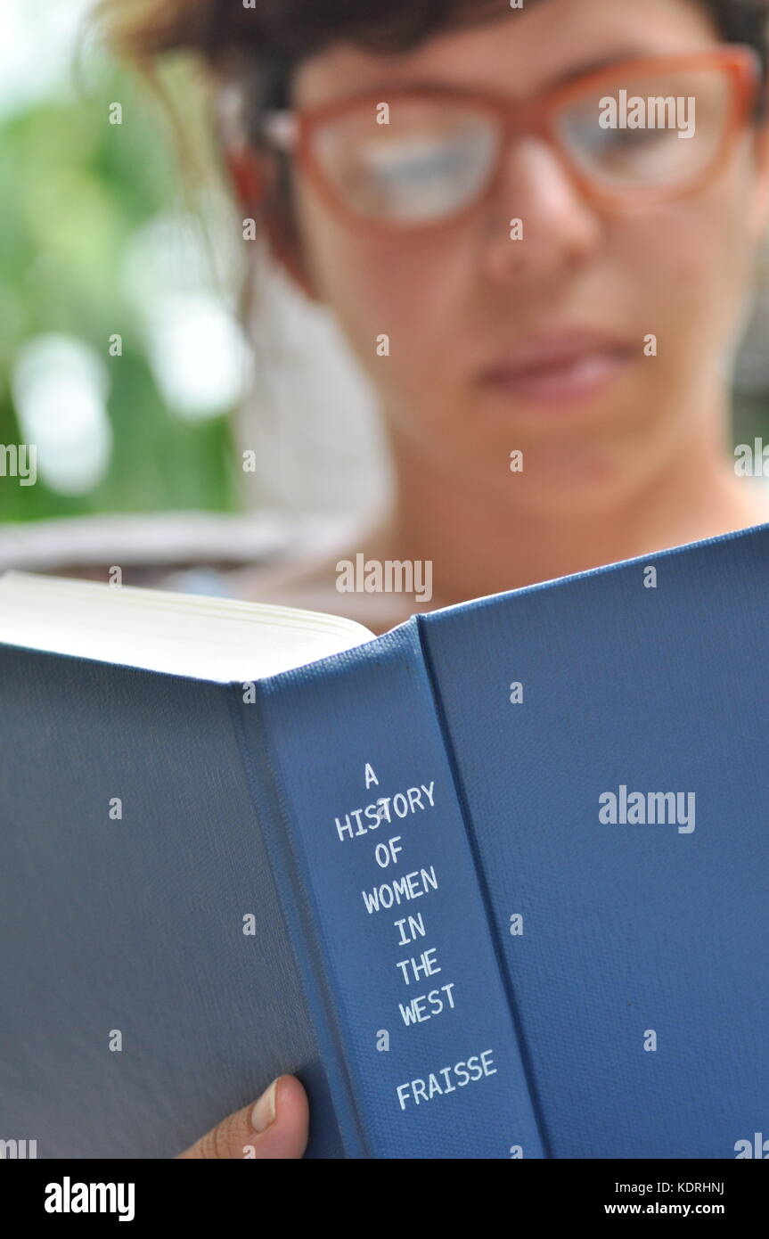 Young Lady reading a book, "The History of Women in the West" by ...