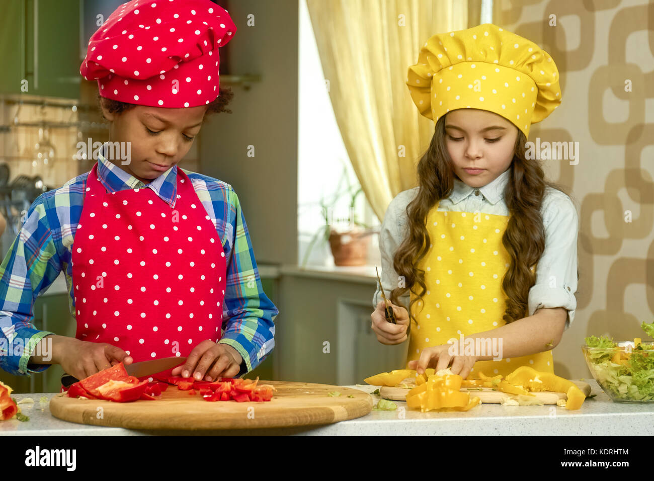 Boy and girl cooking Stock Photo - Alamy