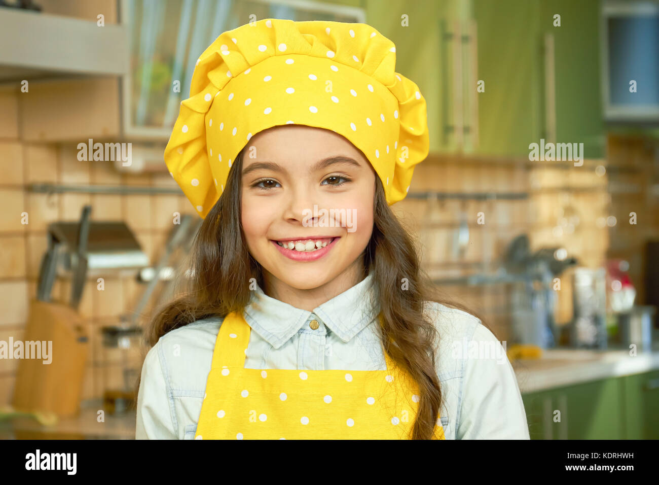 Smiling girl in chef uniform Stock Photo - Alamy
