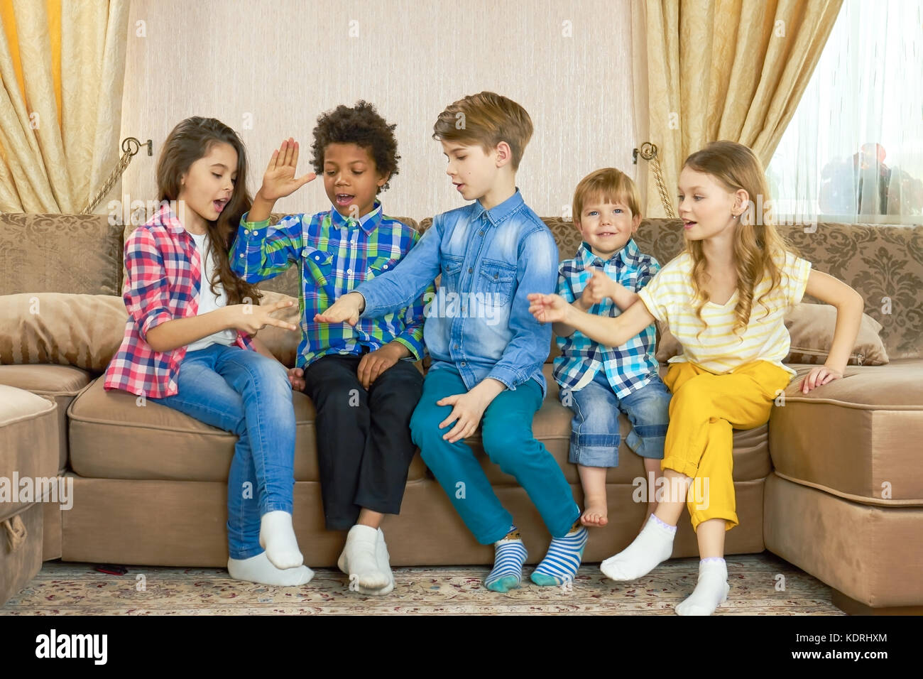 Children playing rock, paper, scissors High Resolution Stock ...