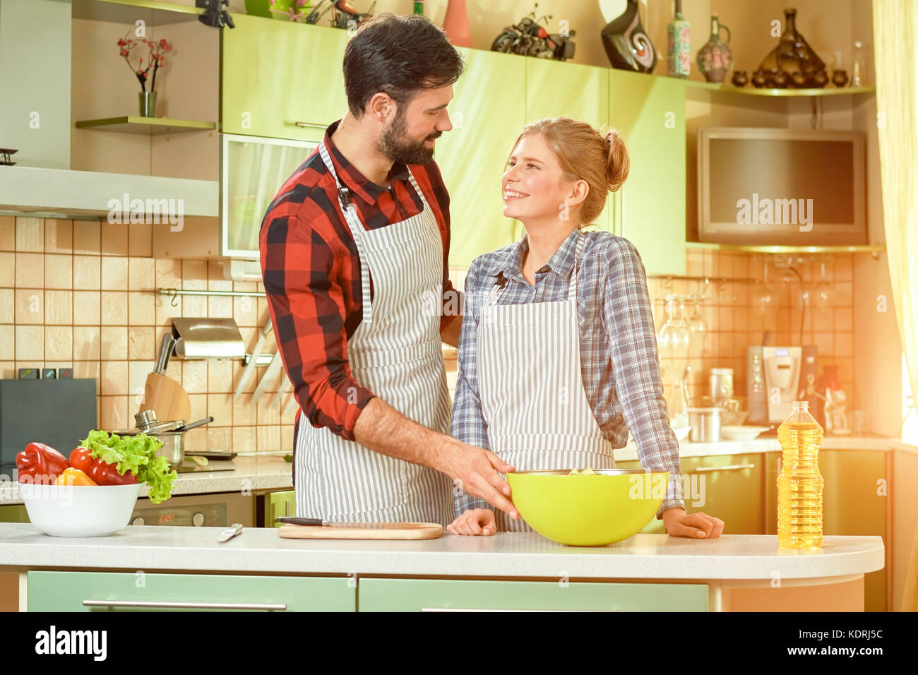 Couple in the kitchen Stock Photo - Alamy