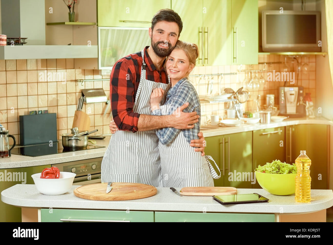 Man and woman hugging, kitchen Stock Photo - Alamy