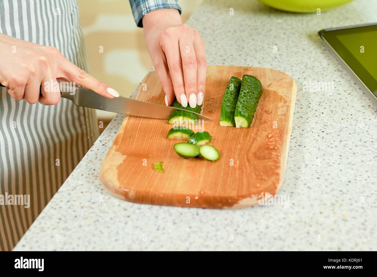 Fitness woman cutting cucumber hi-res stock photography and images - Alamy
