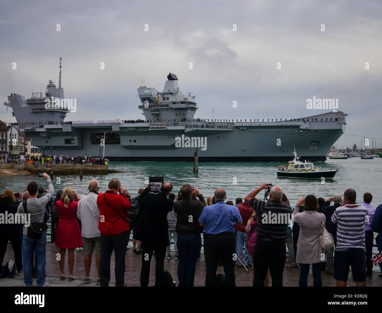 HMS Queen Elizabeth enters her new home Port of Portsmouth Harbour for ...