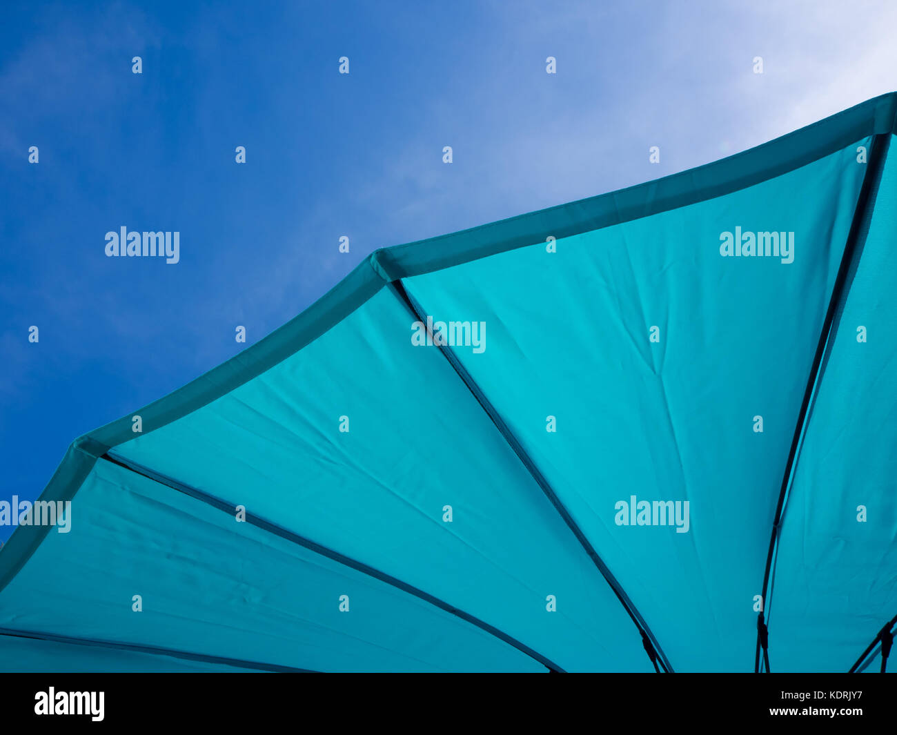 Blue parasol hi-res stock photography and images - Alamy