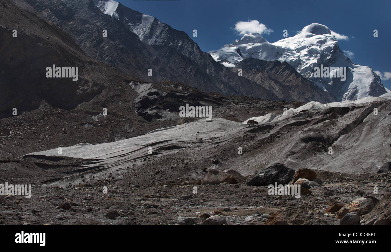High mountains glacier: huge blocks of ice lie on the slopes of the ...